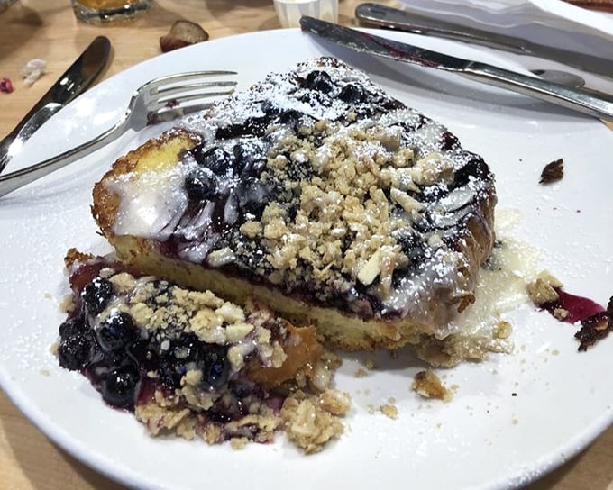 Blueberry French toast that belongs in the breakfast hall of fame. Those berries aren't just fruit—they're little purple flavor bombs in a landscape of buttery goodness.