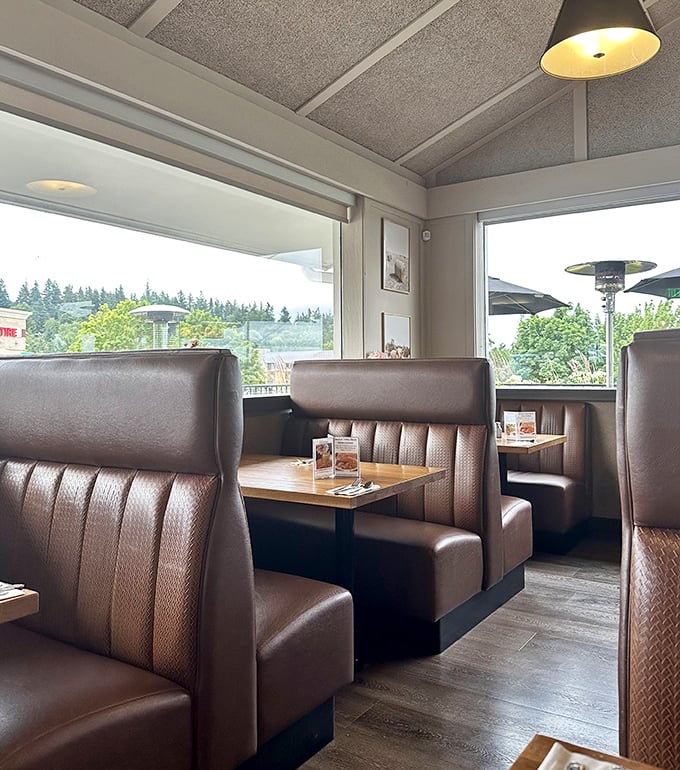 These aren't just booths—they're cocoons of comfort where you can settle in for a leisurely meal with views of the Pacific Northwest.