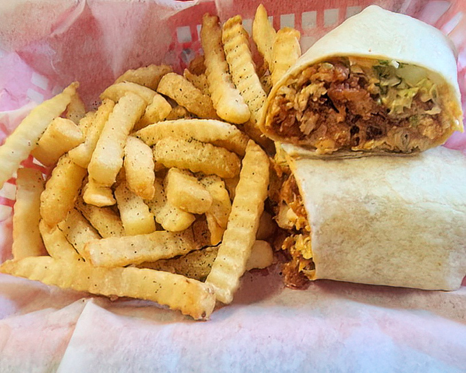 This buffalo chicken wrap isn't just lunch—it's a masterclass in texture and flavor, with fries that could make a potato proud.