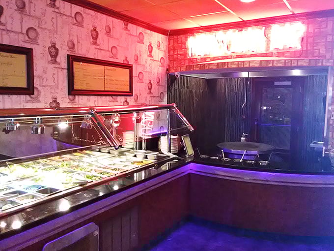 The buffet line awaits, illuminated like a runway of culinary possibilities. Your move, hungry traveler.