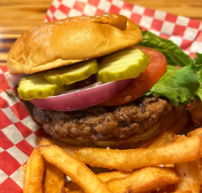 A burger that doesn't need Instagram filters to look good. Thick, juicy, and adorned with the classics—proof that innovation isn't always necessary.