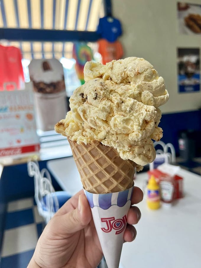 Cone artists at work—this isn't just ice cream, it's a hand-held happiness delivery system in a perfectly crisp waffle vessel.