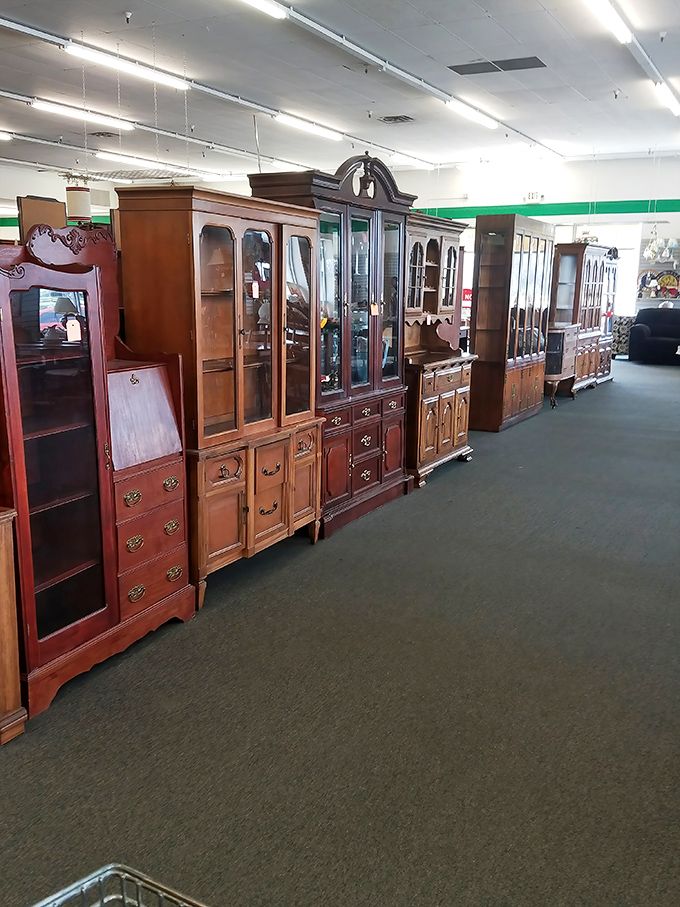 Magnificent wooden cabinets stand like sentinels of a bygone era. Craftsmanship that whispers, "They don't make 'em like this anymore."