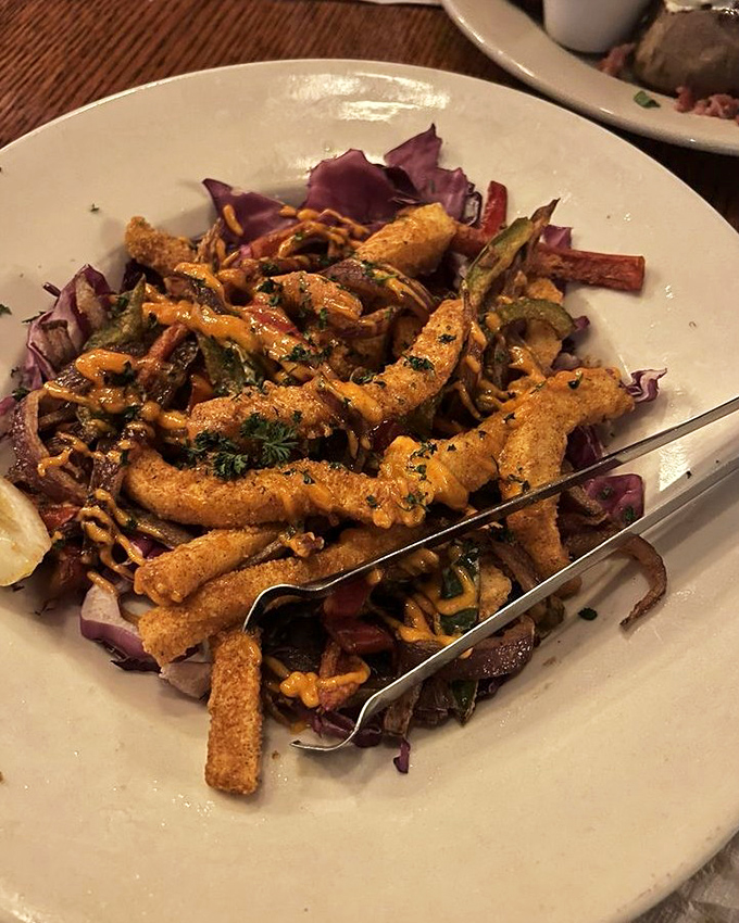 Calamari Fritti that's actually tender, not rubber bands in disguise. The crispy coating and vibrant presentation make seafood skeptics into believers.
