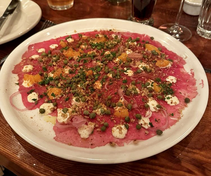 Carpaccio that's dressed to impress. Paper-thin beef adorned with capers, cheese, and citrus – a symphony of flavors in every bite.