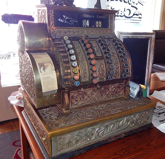 This vintage cash register isn't just decoration—it's a time machine to when transactions came with conversation and a genuine "come back soon."