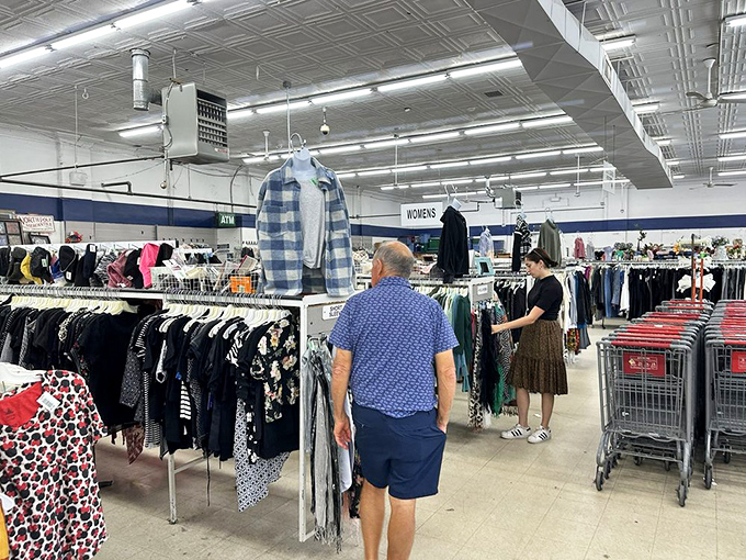The casual apparel section: where flannel meets function. These racks have seen more Pittsburgh weather changes than the local meteorologists.
