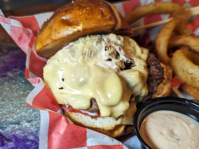 Behold, the perfect burger architecture—melty cheese cascading down a thick patty, nestled in a toasted bun. Resistance is futile.