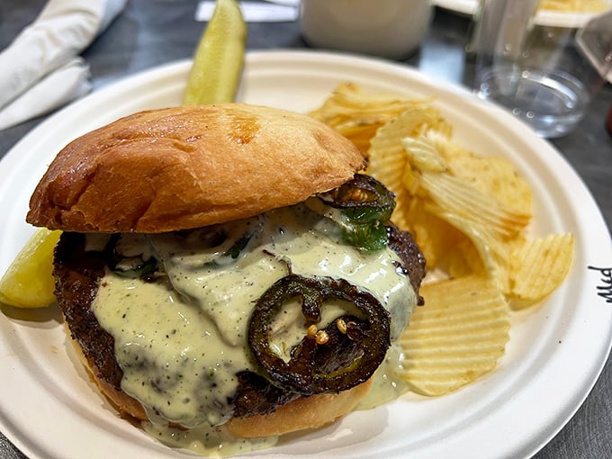 A burger that requires both hands and several napkins. Those grilled jalapeños aren't just for show—they mean delicious business.