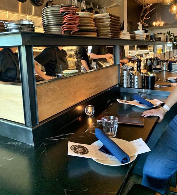 The chef's counter—where curious diners get the director's cut version of dinner. Front-row seats to culinary theater are always worth the ticket.