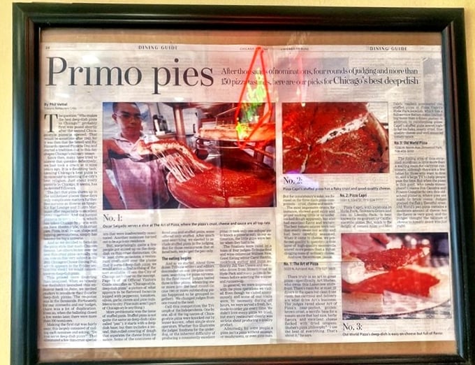 Framed newspaper accolades serve as diploma and doctorate for this PhD in Pizza-ology. The critics have spoken, and they're drooling. 