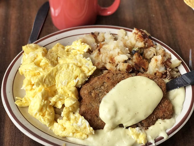 Country-fried steak with gravy alongside scrambled eggs and home fries—the breakfast equivalent of a standing ovation for your taste buds.