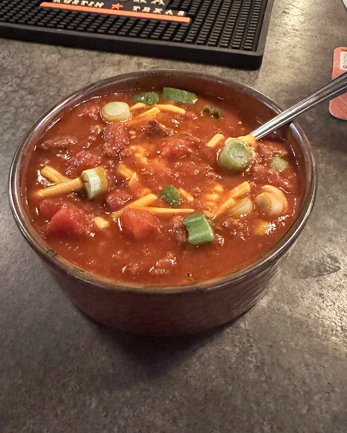 A hearty bowl of homestyle chili packed with vegetables and pasta – the kind of comfort food that makes winter almost welcome.