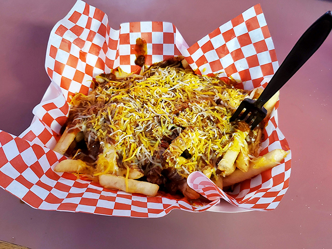 Chili cheese fries that don't mess around—a mountain of crispy potatoes buried under an avalanche of savory chili and melted cheese glory.