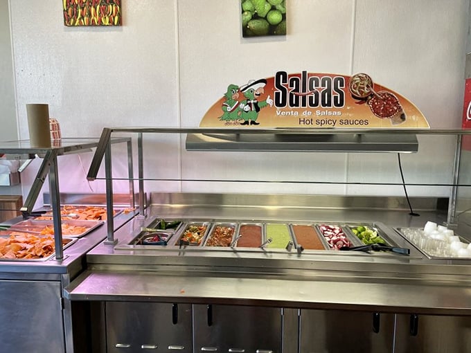 The salsa bar—that magnificent buffet of heat where mild-mannered diners transform into spice adventurers one tiny plastic cup at a time.