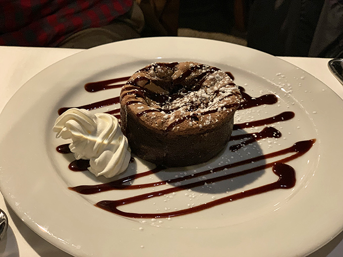 Chocolate lava cake: where structural engineering meets dessert. That moment when your spoon breaks the surface is pure theater.