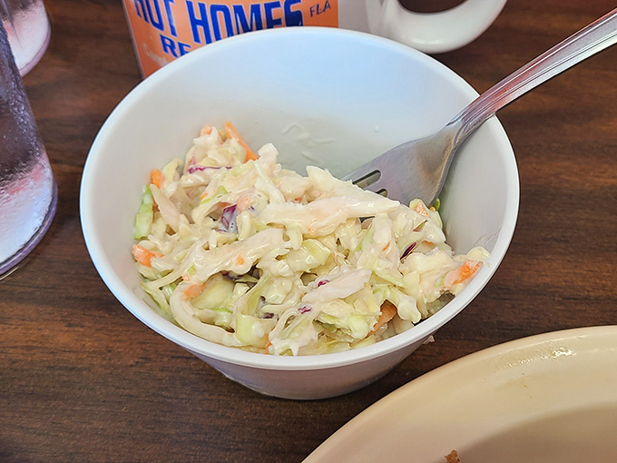 Even the coleslaw gets the respect it deserves – crisp, tangy, and refreshingly honest.
