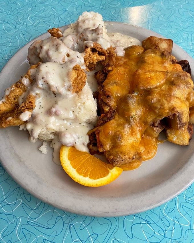 Two different gravies on one plate? This isn't just breakfast—it's a masterclass in Southern cuisine with a side of orange sunshine.