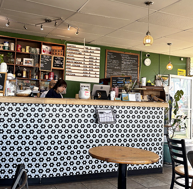 The black and white tiled counter feels both retro and timeless – like the diner of your childhood memories, but with coffee that's actually good.