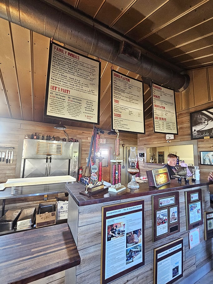 The order counter—where dreams are placed and fulfilled. Those trophies aren't just decoration; they're promises of what's to come.