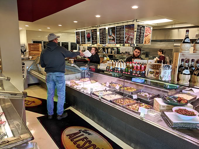 The counter where magic happens—where "I'll just have a small sandwich" turns into "and pasta salad, and cannoli, and..."