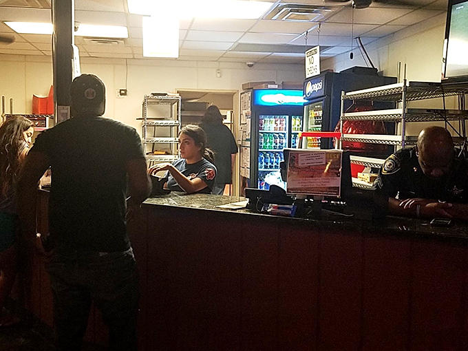 Where pizza dreams begin their journey from order to reality—the counter where hungry hope transforms into delicious certainty.