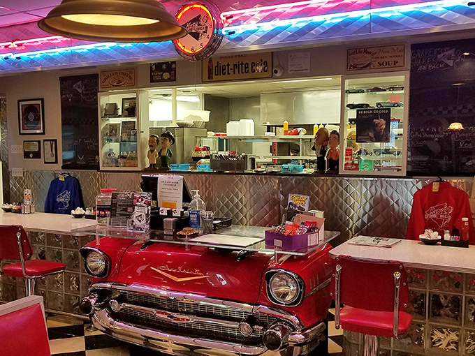 That classic car front end isn't just decoration—it's the perfect metaphor for this diner: vintage American engineering designed for maximum satisfaction.