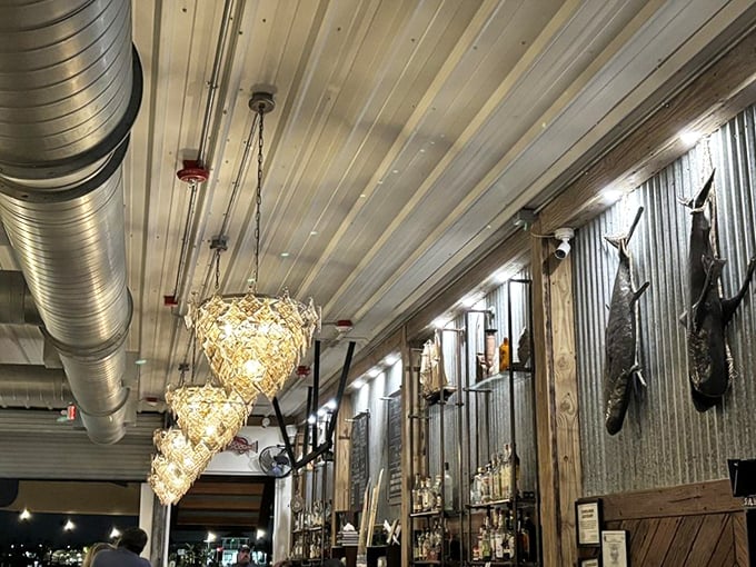 Fishing trophies and oyster shell chandeliers—because when you're this close to the water, even the lighting should tell a maritime story.
