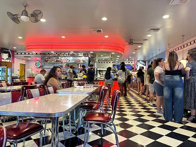 The line forms for good reason—these patrons aren't just waiting for cake, they're queuing for happiness served on a plate.