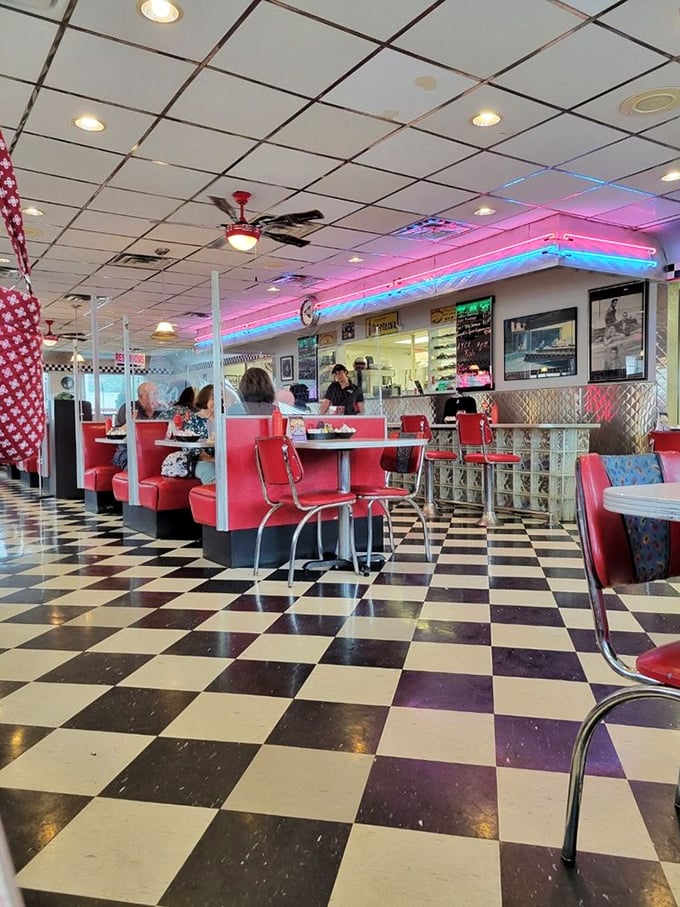 The counter seating—where solo diners become regulars and waitresses remember exactly how you like your eggs after just one visit.