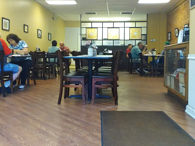 A dining room where strangers become neighbors over coffee refills. No one's staring at their phones—they're too busy enjoying actual conversation. 