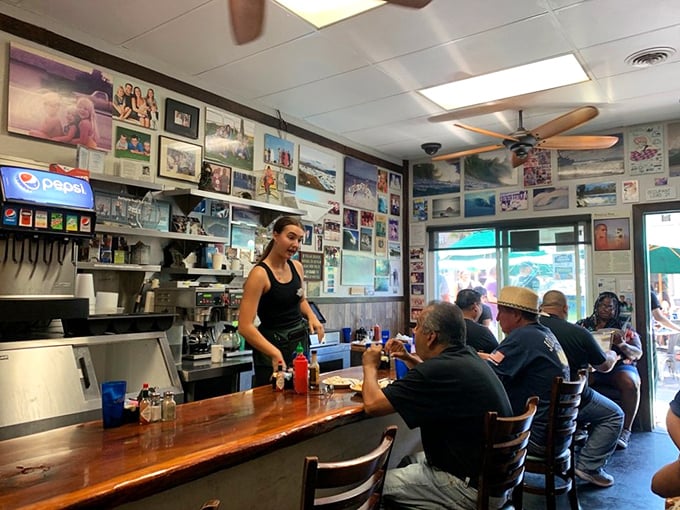 The counter seating—where regulars exchange local gossip and newcomers get the authentic Sugar Shack experience. Community served alongside breakfast.