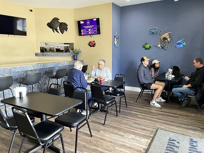 A glimpse of happy diners experiencing what vacation commercials promise but rarely deliver—authentic Florida seafood moments without the tourist price tag.