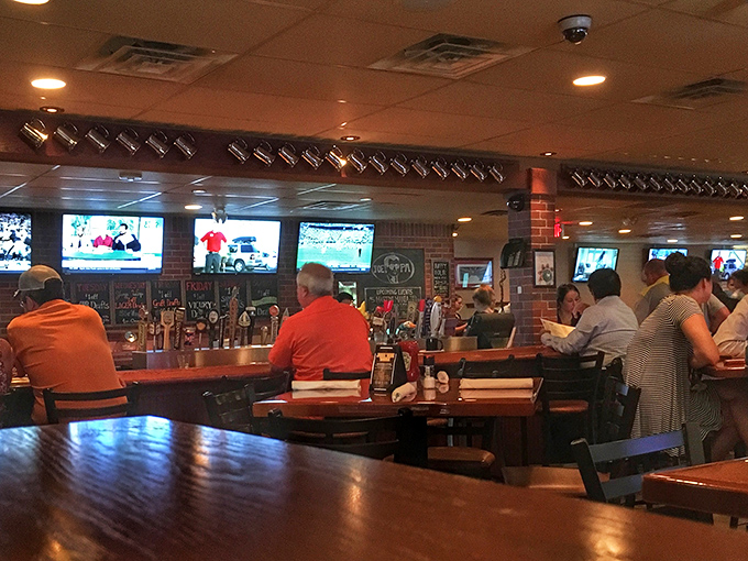 The bar area during game time – where strangers become friends united by sports, good food, and the shared language of "pass the ketchup."