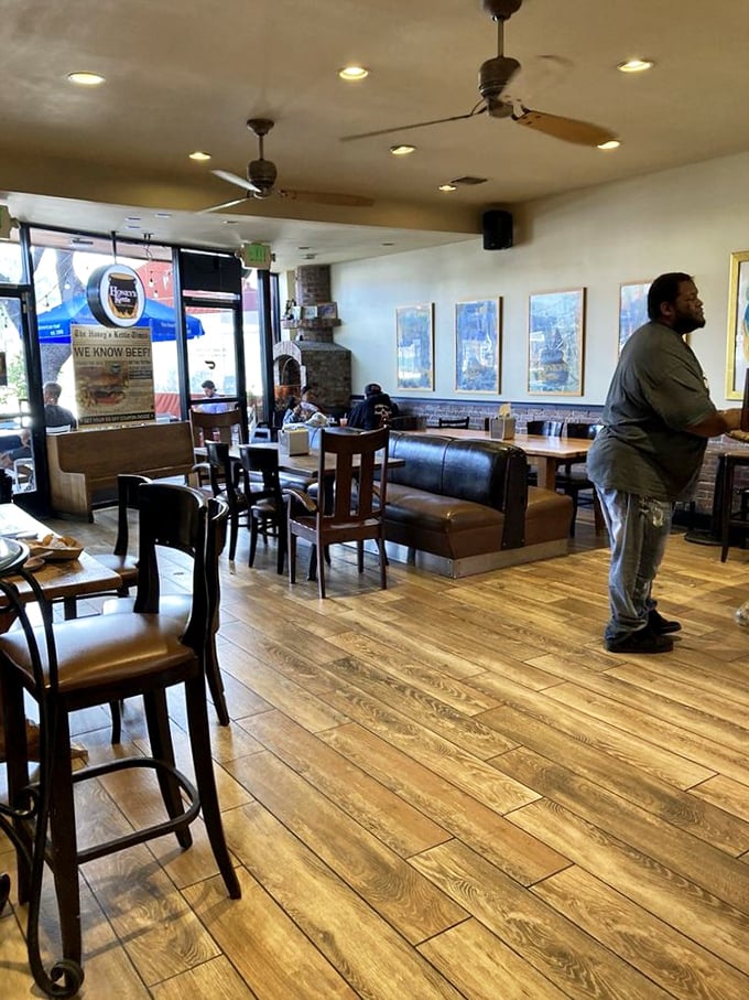 The warm, inviting dining room where strangers become friends, united by the universal language of exceptional fried chicken.