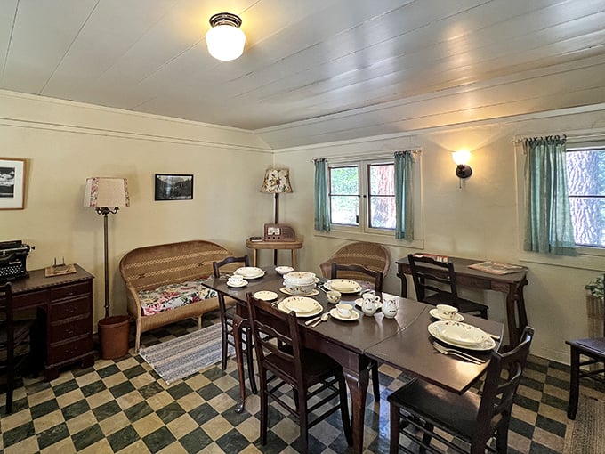 Checkerboard floors and wicker furniture create a surprisingly cozy dining space. Imagine the conversations that flowed around this table over afternoon tea.