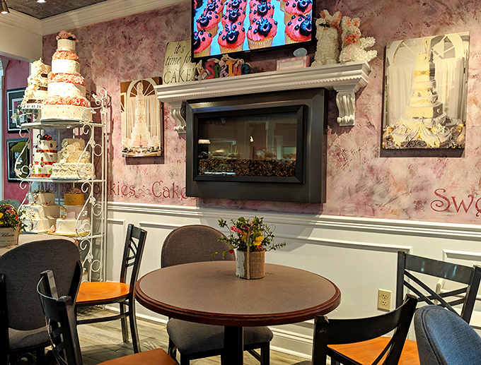 The pink-walled dining area with its elegant fireplace creates an atmosphere where calories simply don't count—it's bakery science.