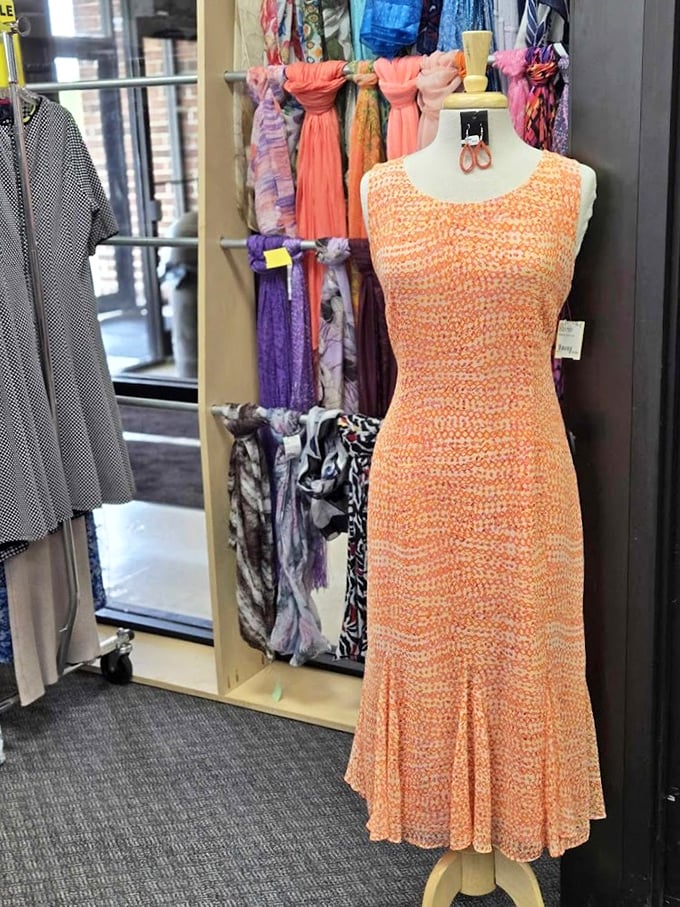 This coral dream doesn't just hang on a mannequin; it waits patiently for its next dance floor, garden party, or wherever compliments are served.