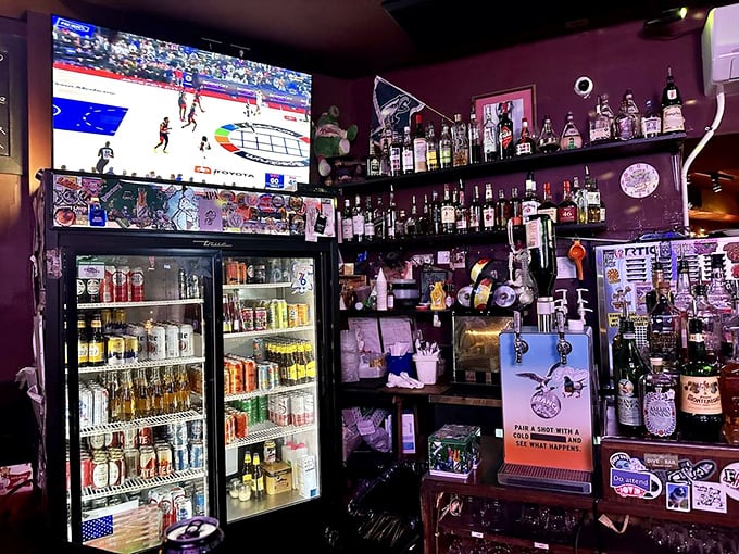 The purple-hued bar corner, where bottles stand at attention and a hockey game plays overhead—pure Philadelphia in liquid form.