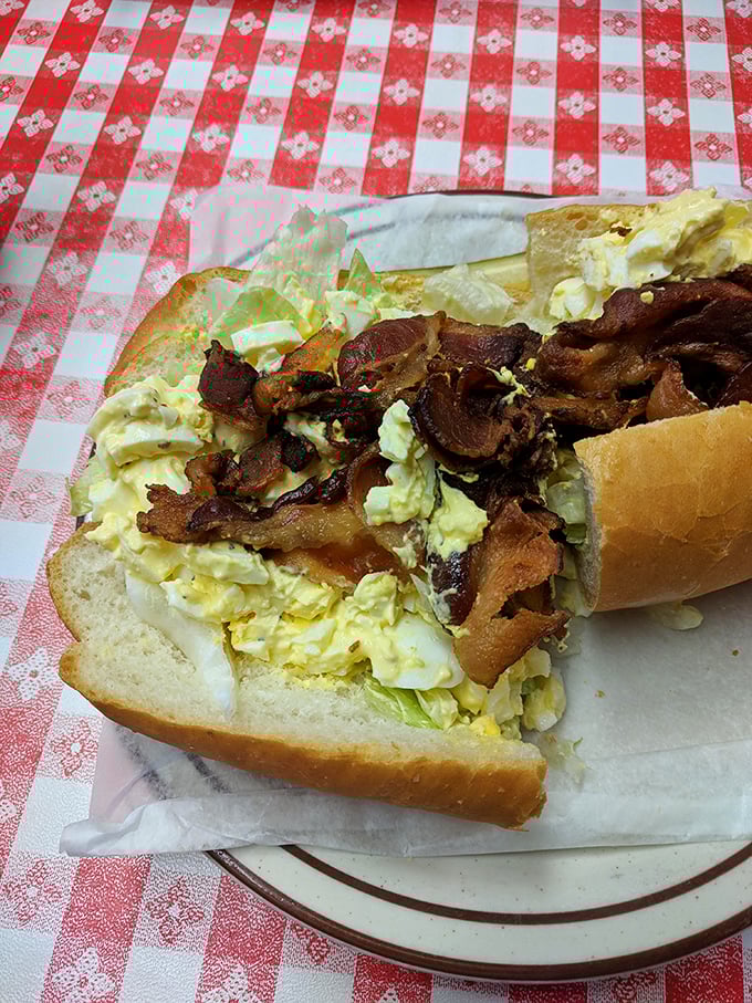 Egg salad and bacon – breakfast and lunch having a delicious reunion party on bread. The mayo brings everyone together like a culinary peacemaker. 