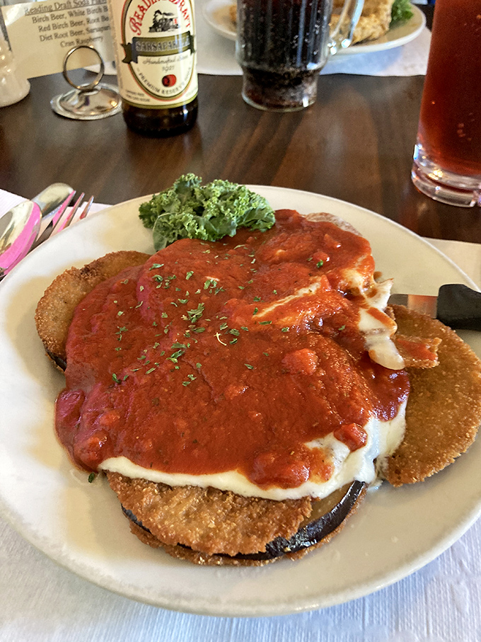 Eggplant parmesan that doesn't hide behind pretension – just layers of crispy, saucy, cheesy goodness that would make any Italian grandmother nod in approval.