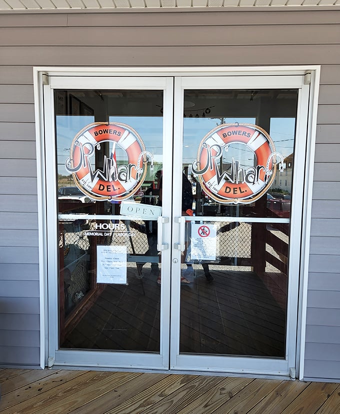The entrance to seafood paradise—where that life preserver logo promises to save you from mediocre dining experiences.