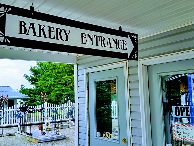 The "Bakery Entrance" sign might as well say "Abandon All Diets, Ye Who Enter Here" – a portal to delicious temptation.