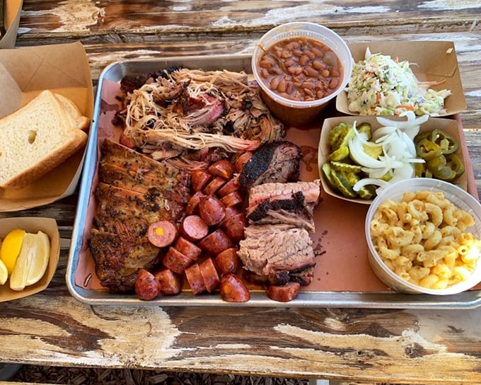 The barbecue motherload—a tray that answers all of life's important questions. Multiple meats, multiple sides, multiple reasons to loosen your belt.