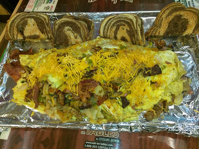 The Farmer's Omelet Challenge isn't just breakfast—it's an edible monument to excess, complete with enough cheese to make Wisconsin proud.
