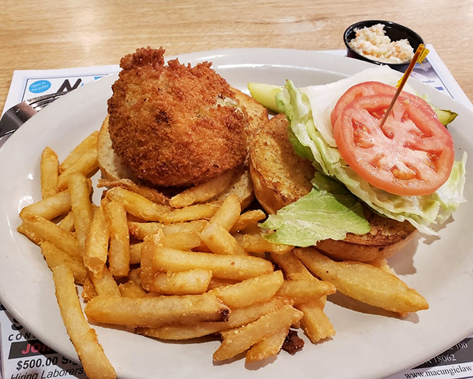 This isn't just fried fish – it's a testament to the simple pleasure of a perfectly crisp exterior giving way to flaky white fish beneath.