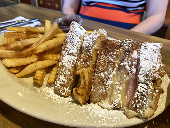 This isn't just French toast – it's a powdered sugar-dusted monument to indulgence that makes you forget you're supposed to be watching your carbs.