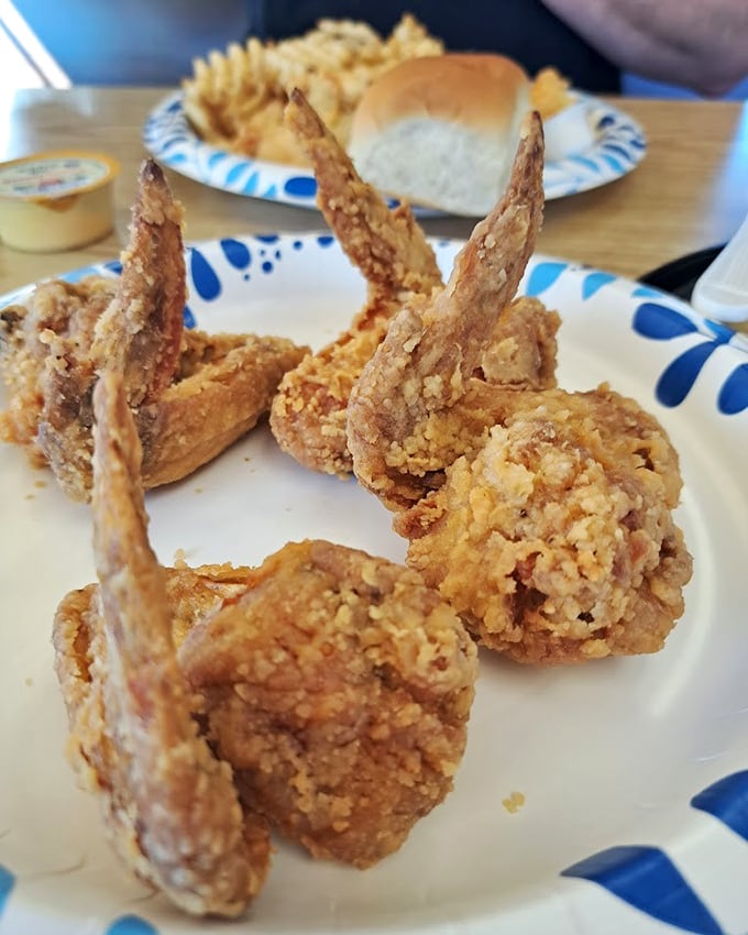 Wings with that perfect ratio of crispy coating to juicy meat—architectural marvels of the fried food world that demand to be appreciated piece by piece.