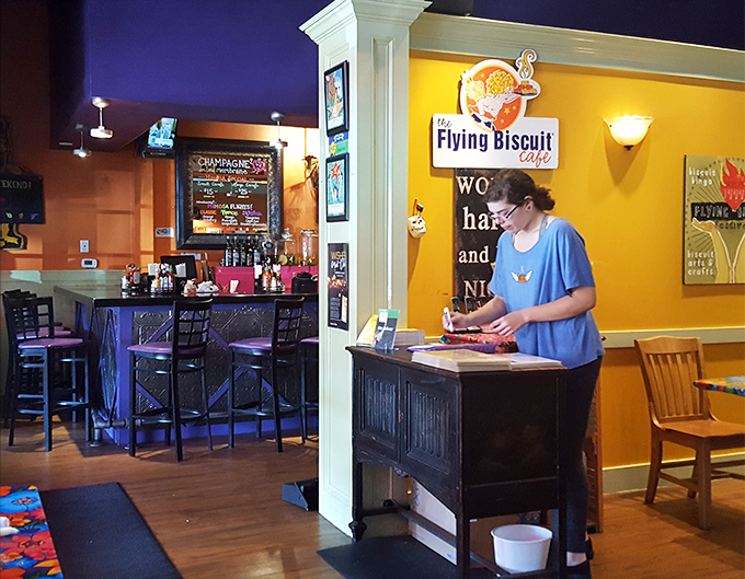 The host stand—that magical gateway between hunger and satisfaction, staffed by the keepers of the breakfast kingdom's treasures.