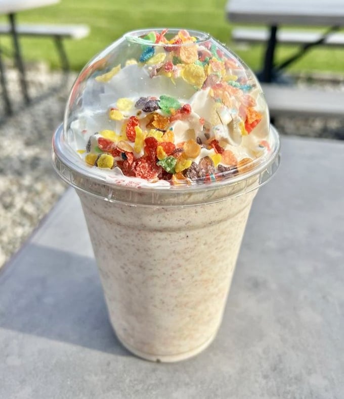 This isn't just a milkshake—it's childhood nostalgia in a cup, topped with enough Fruity Pebbles to make your inner eight-year-old high-five your adult self.